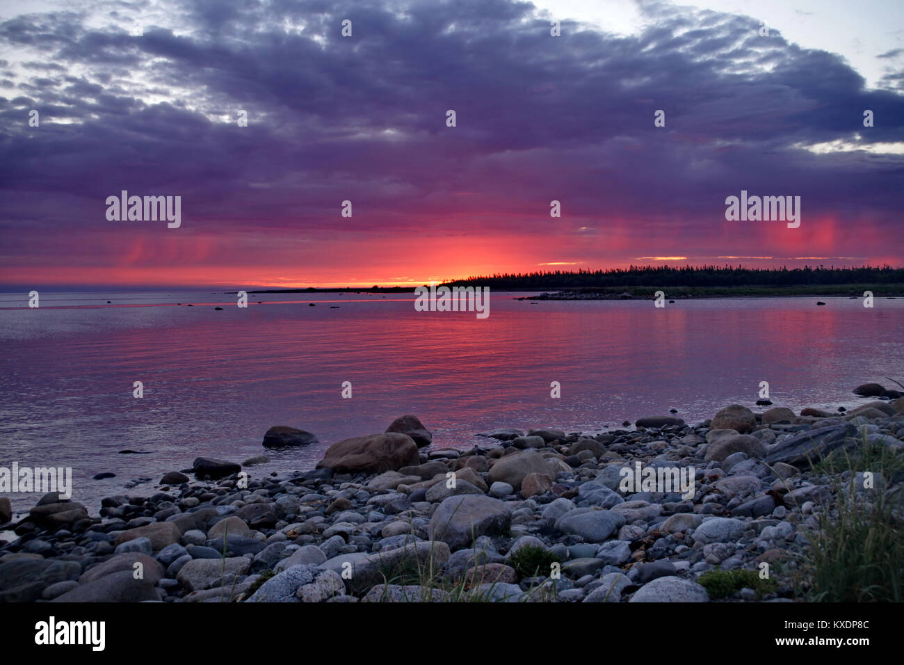White night, colorful sunset over the sea, dark cloudy sky Stock Photo ...