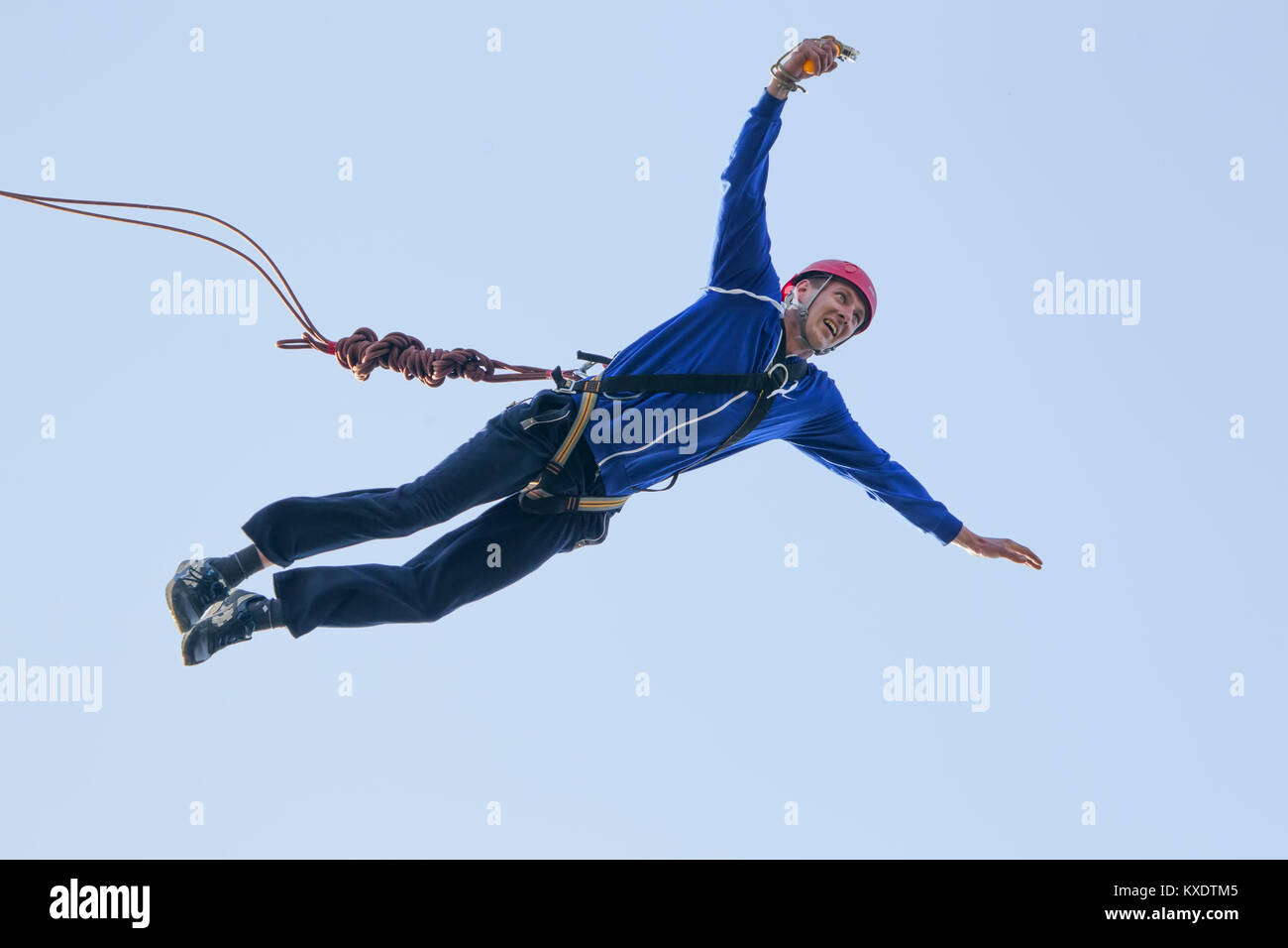Belarus, Gomel, May 06 2017.Jumping with a rope.Flight down on the rope ...