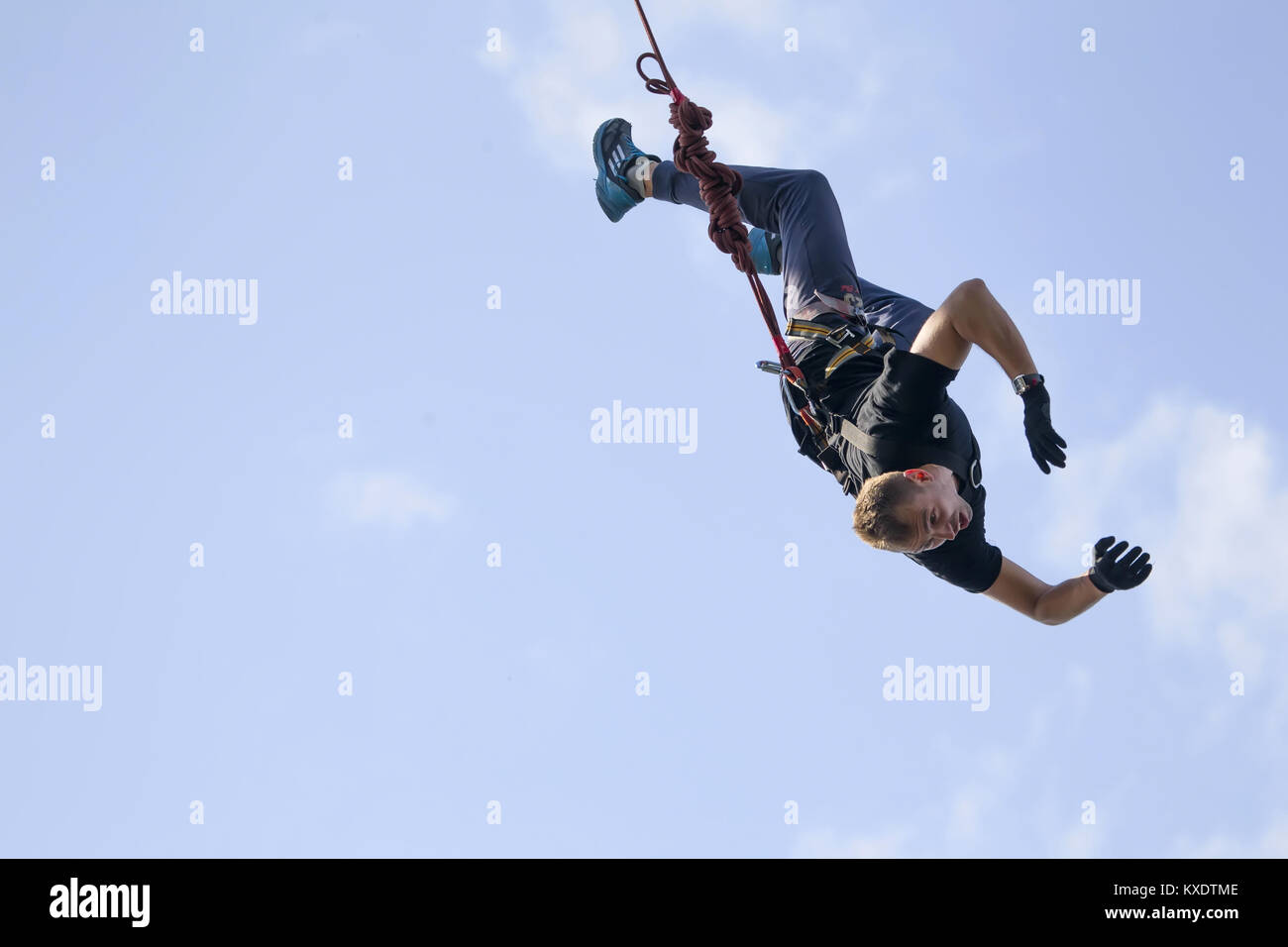 Belarus, Gomel, May 06 2017.Jumping with a rope.Flight down on the rope ...