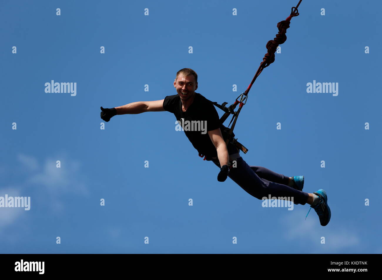 Belarus, Gomel, May 06 2017.Jumping with a rope.Flight down on the rope ...