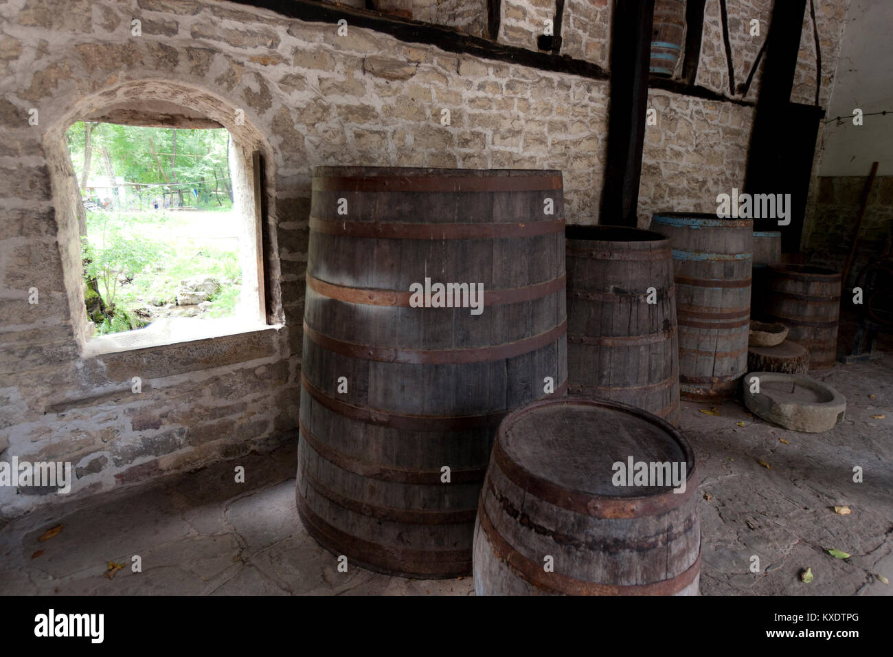 Open old wooden barrels in ancient cellar Stock Photo - Alamy