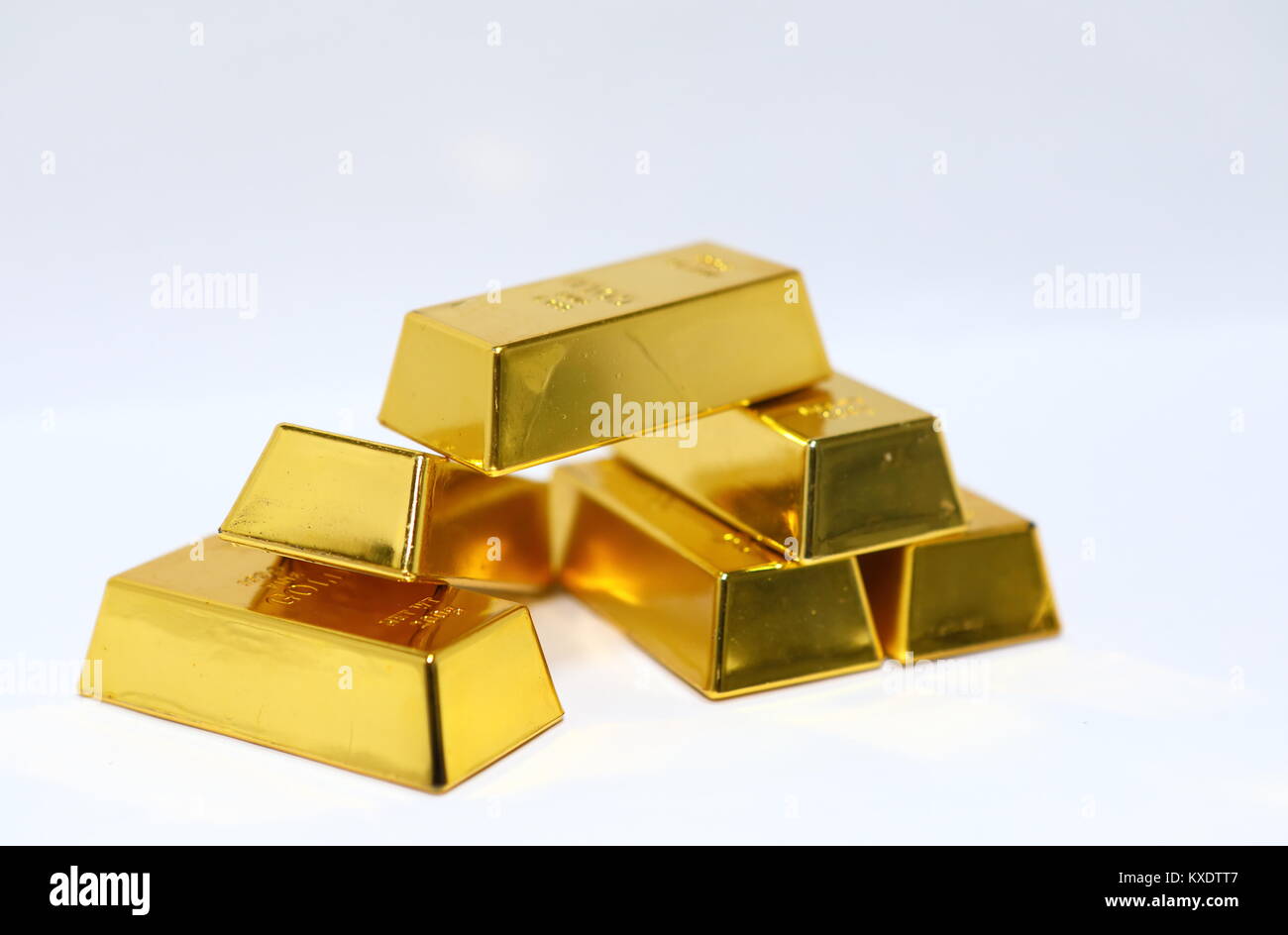 Gold bar ingot pile isolated Stock Photo - Alamy