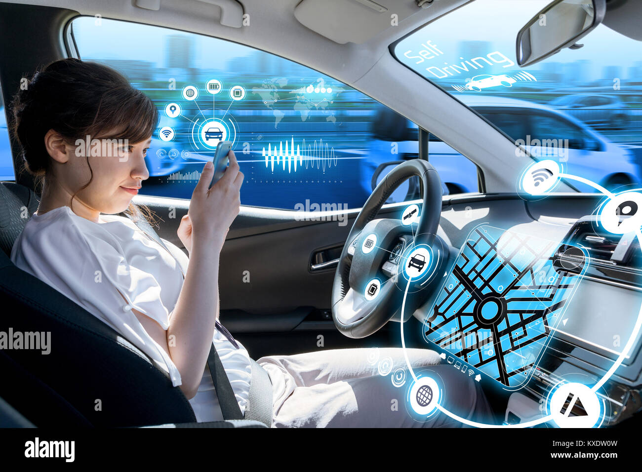woman using smart phone in autonomous car. self driving vehicle ...