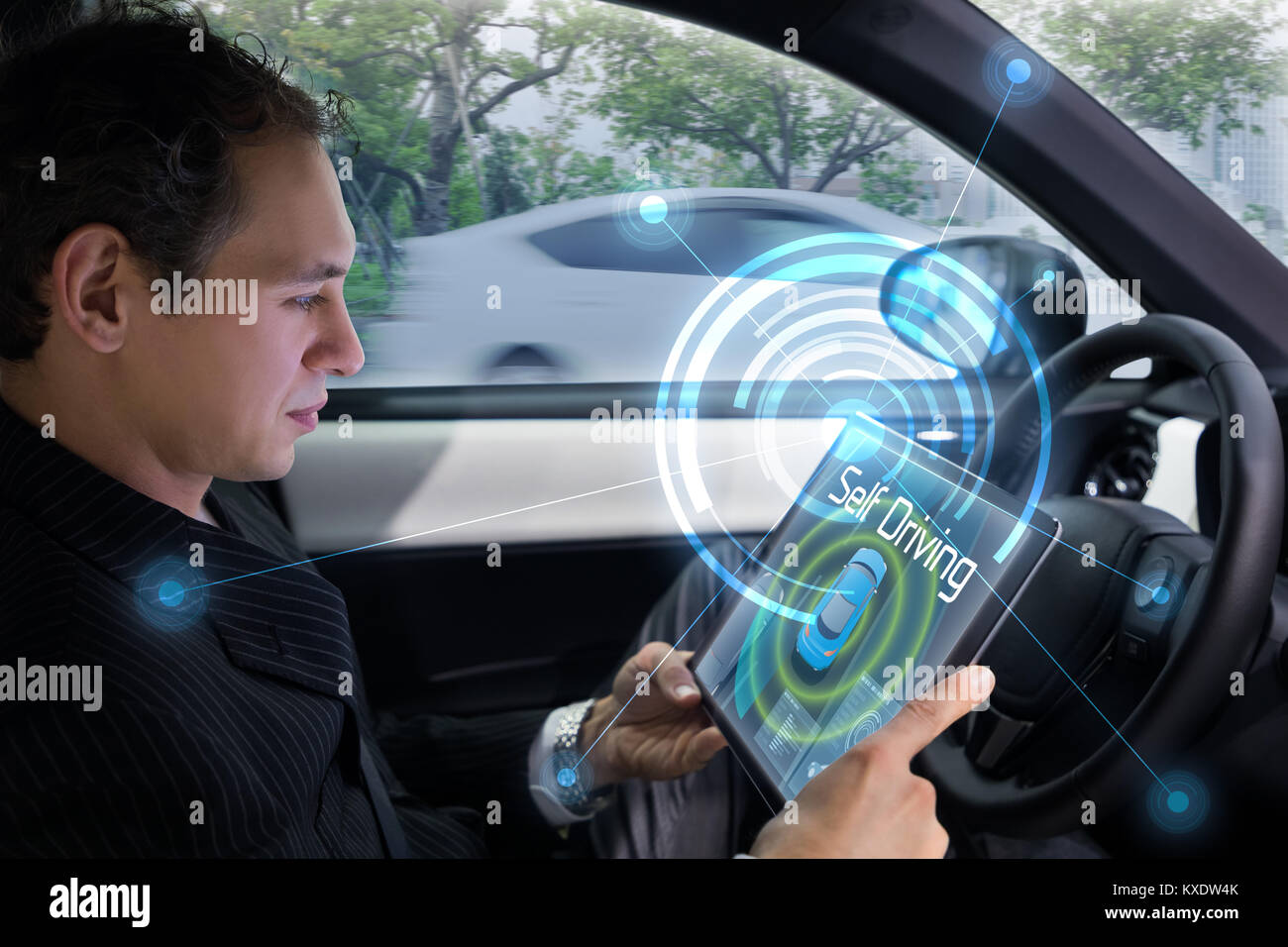 Caucasian man riding autonomous car. Self driving vehicle. Driverless ...