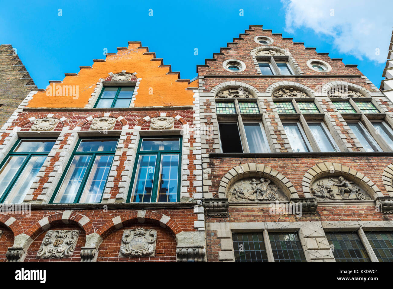 Facade of old historic buildings in the medieval city of Bruges ...