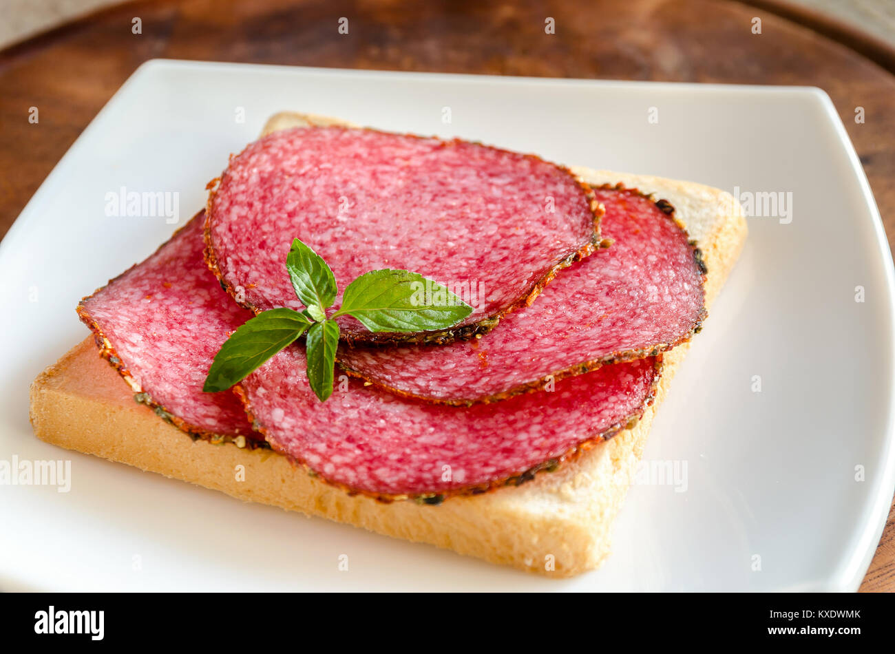 Toast with italian salami Stock Photo - Alamy