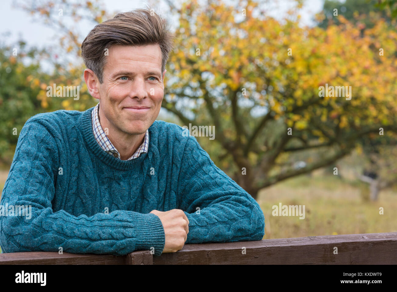 Portrait shot of an attractive, successful and happy middle aged man ...