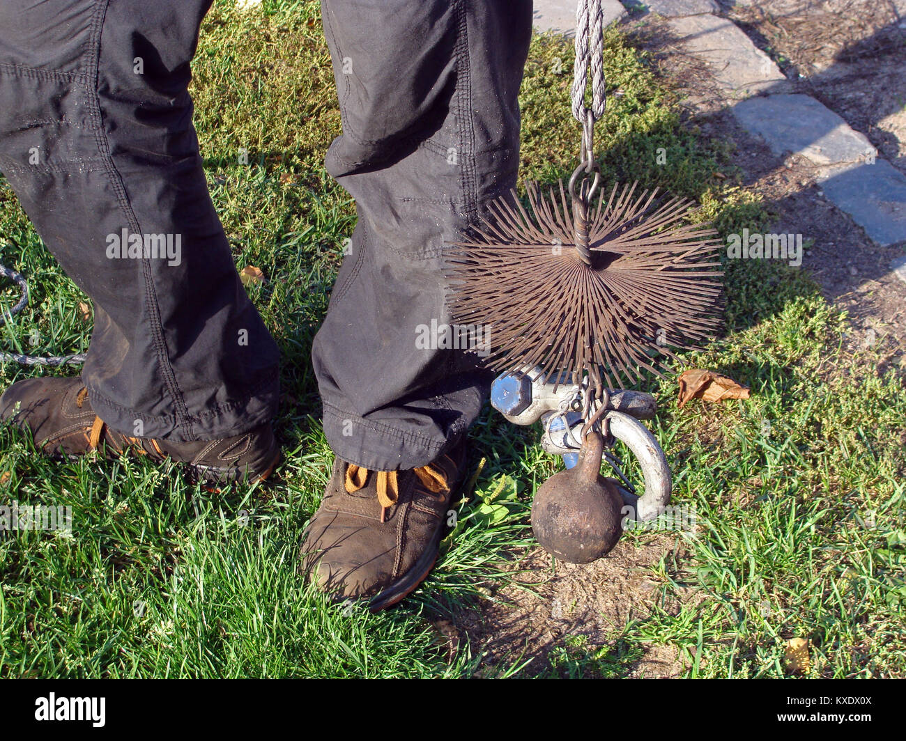 Chimney sweeper tools round wire brush with weight and rope Stock Photo ...