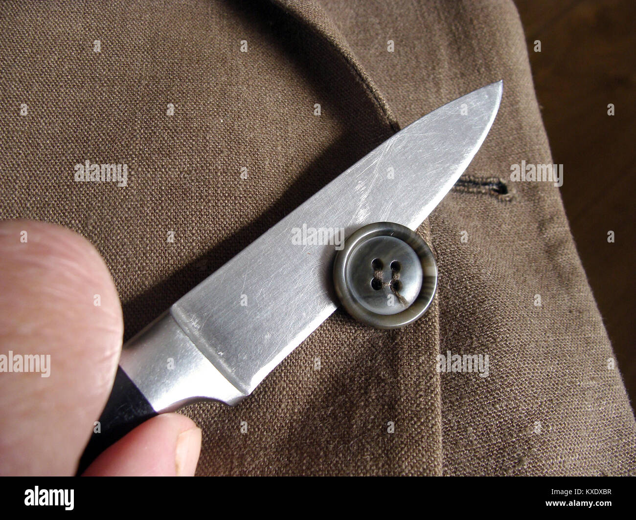 Fabric cutting knife hi-res stock photography and images - Alamy