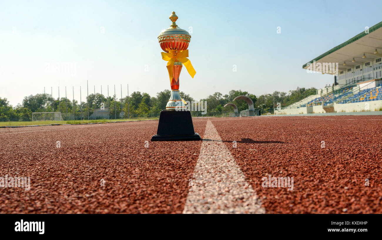gold cup winner, track running Stock Photo - Alamy