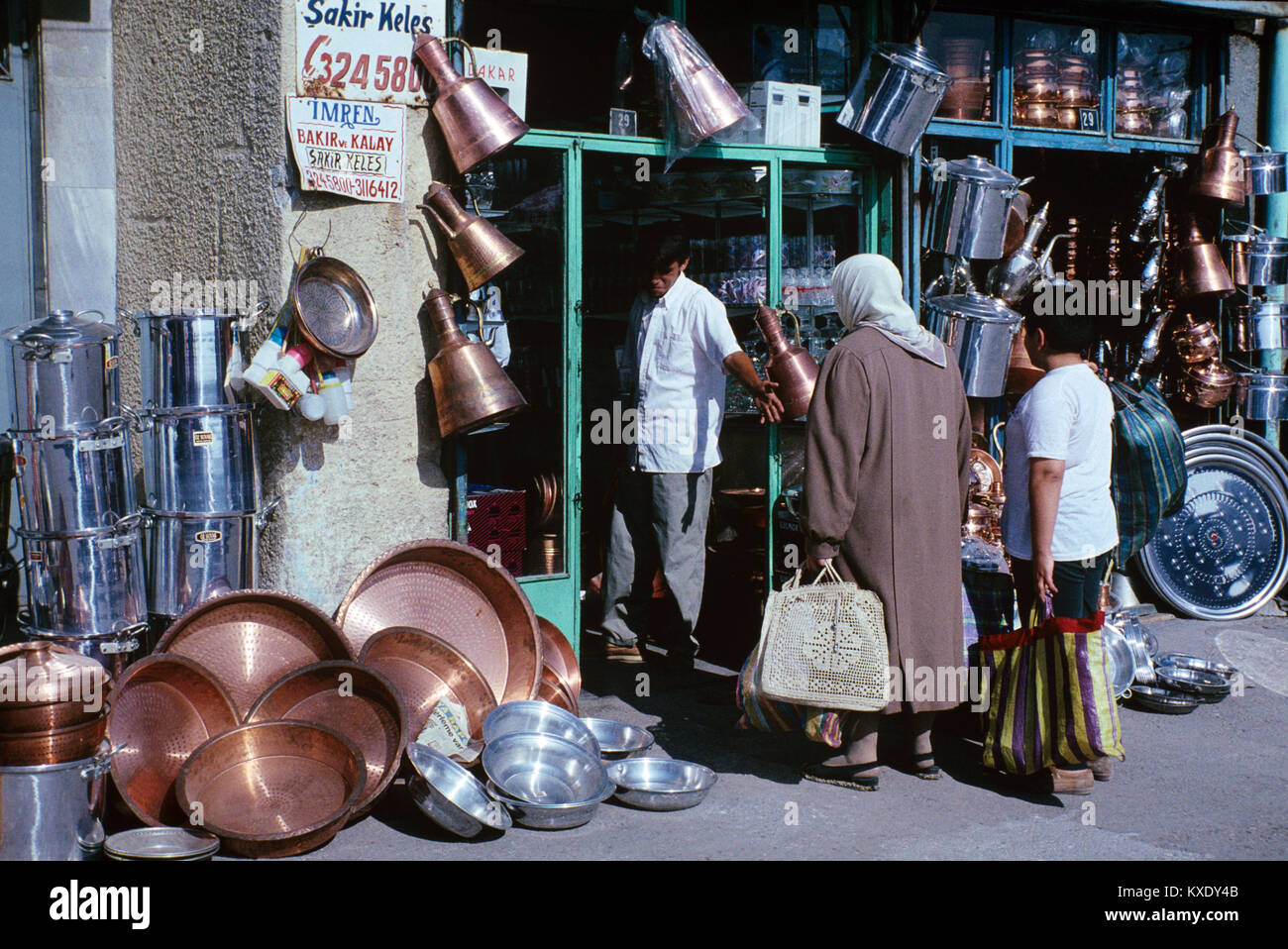 Traditional Turkish Family Shopping Outside a Copper Ware Shop in the ...