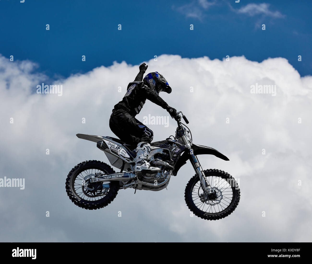 Professional rider at the FMX (Freestyle Motocross) make an acrobatic ...