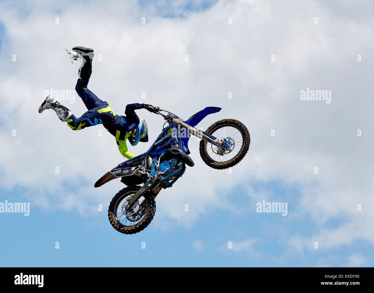 Professional rider at the FMX (Freestyle Motocross) make an acrobatic ...