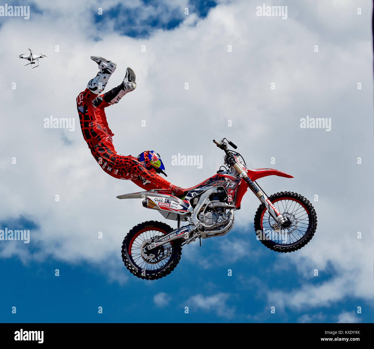 Professional rider at the FMX (Freestyle Motocross) make an acrobatic ...