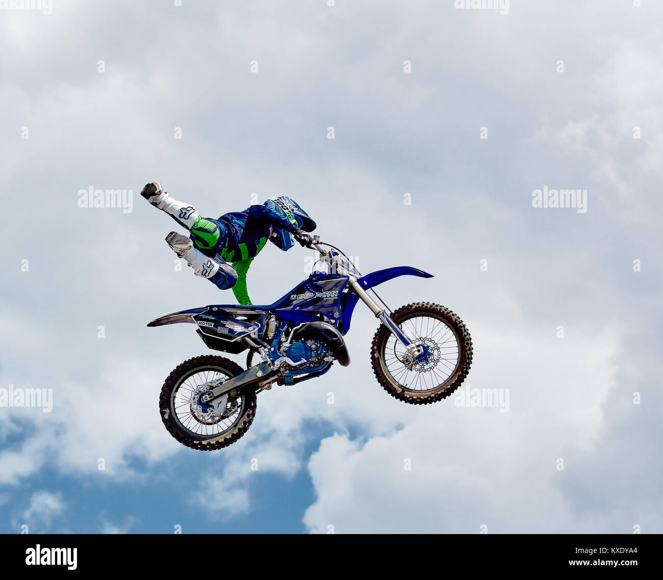 Professional rider at the FMX (Freestyle Motocross) make an acrobatic ...
