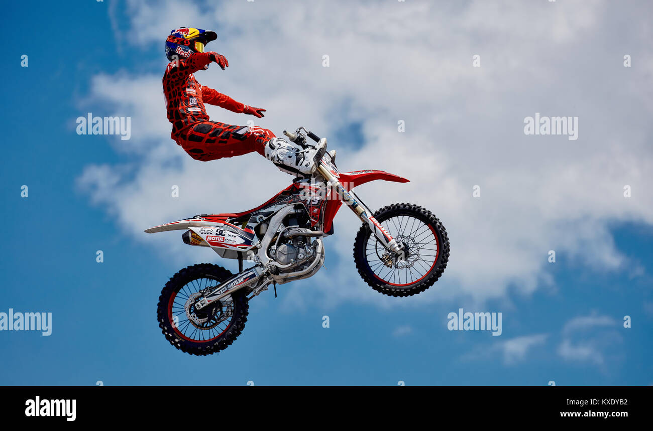 Professional rider at the FMX (Freestyle Motocross) make an acrobatic ...