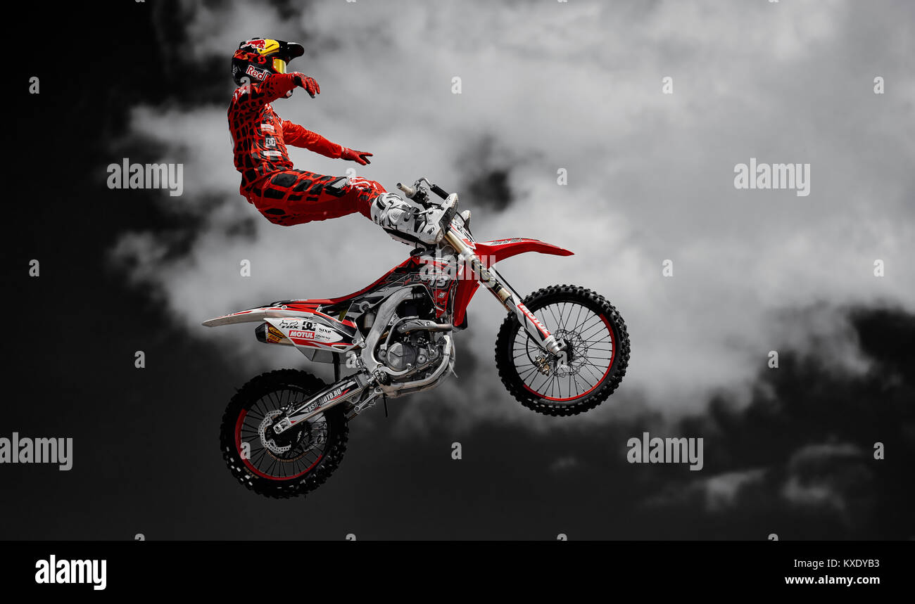 Professional rider at the FMX (Freestyle Motocross) make an acrobatic ...