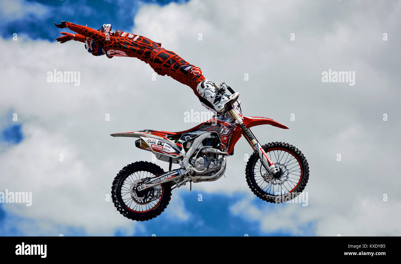 Professional rider at the FMX (Freestyle Motocross) make an acrobatic ...