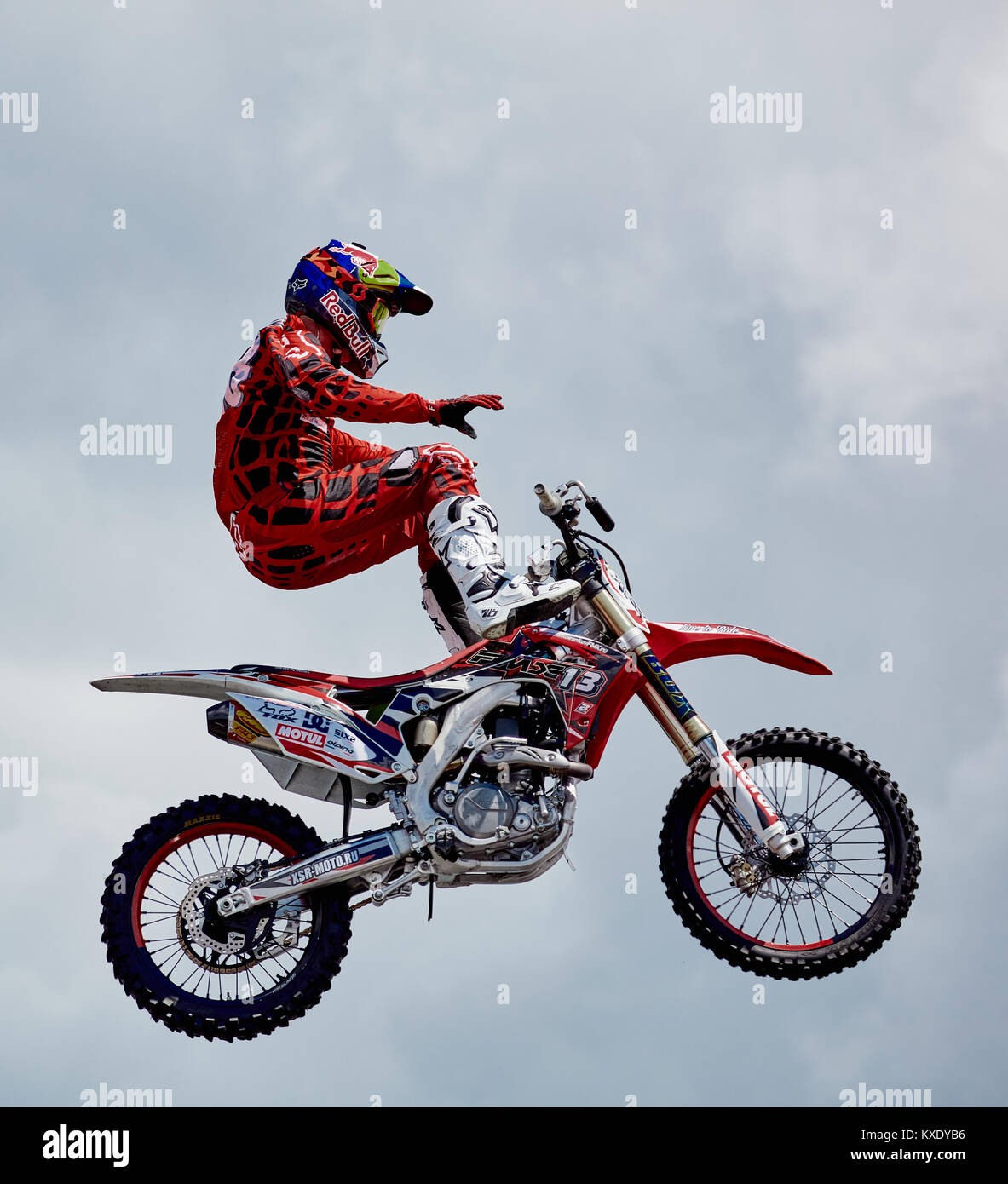 Professional rider at the FMX (Freestyle Motocross) make an acrobatic ...