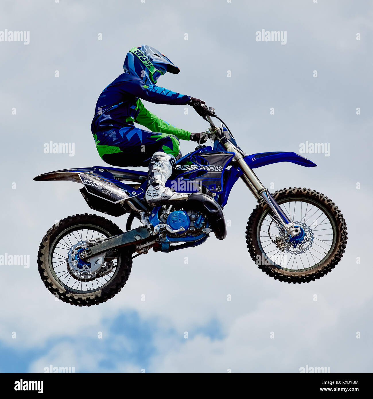 Professional rider at the FMX (Freestyle Motocross) make an acrobatic ...