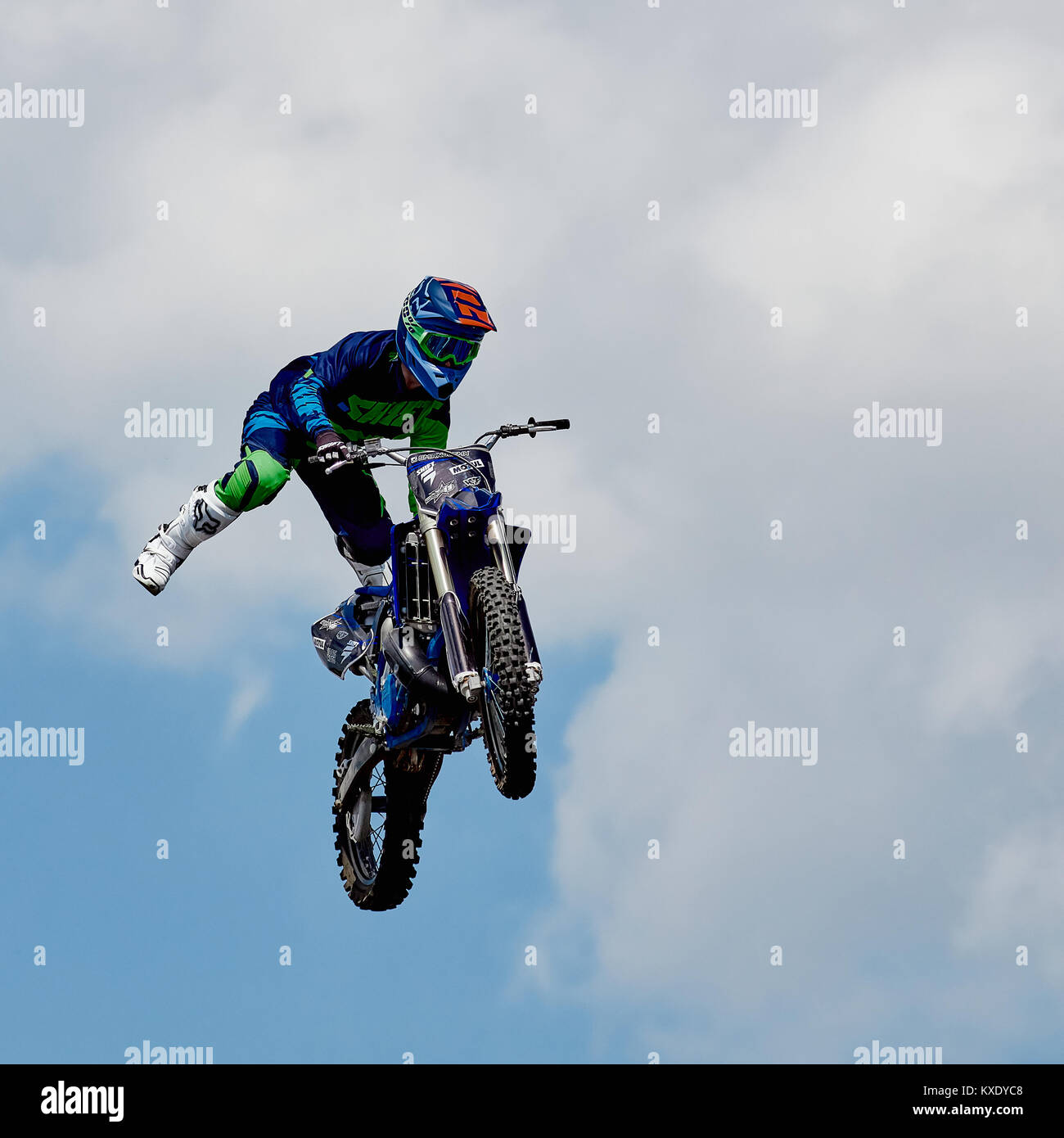 Professional rider at the FMX (Freestyle Motocross) make an acrobatic ...