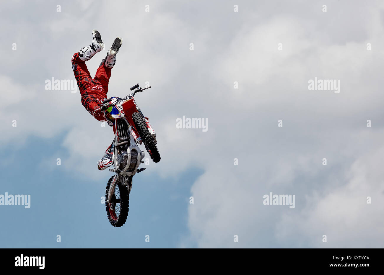 Professional rider at the FMX (Freestyle Motocross) make an acrobatic ...