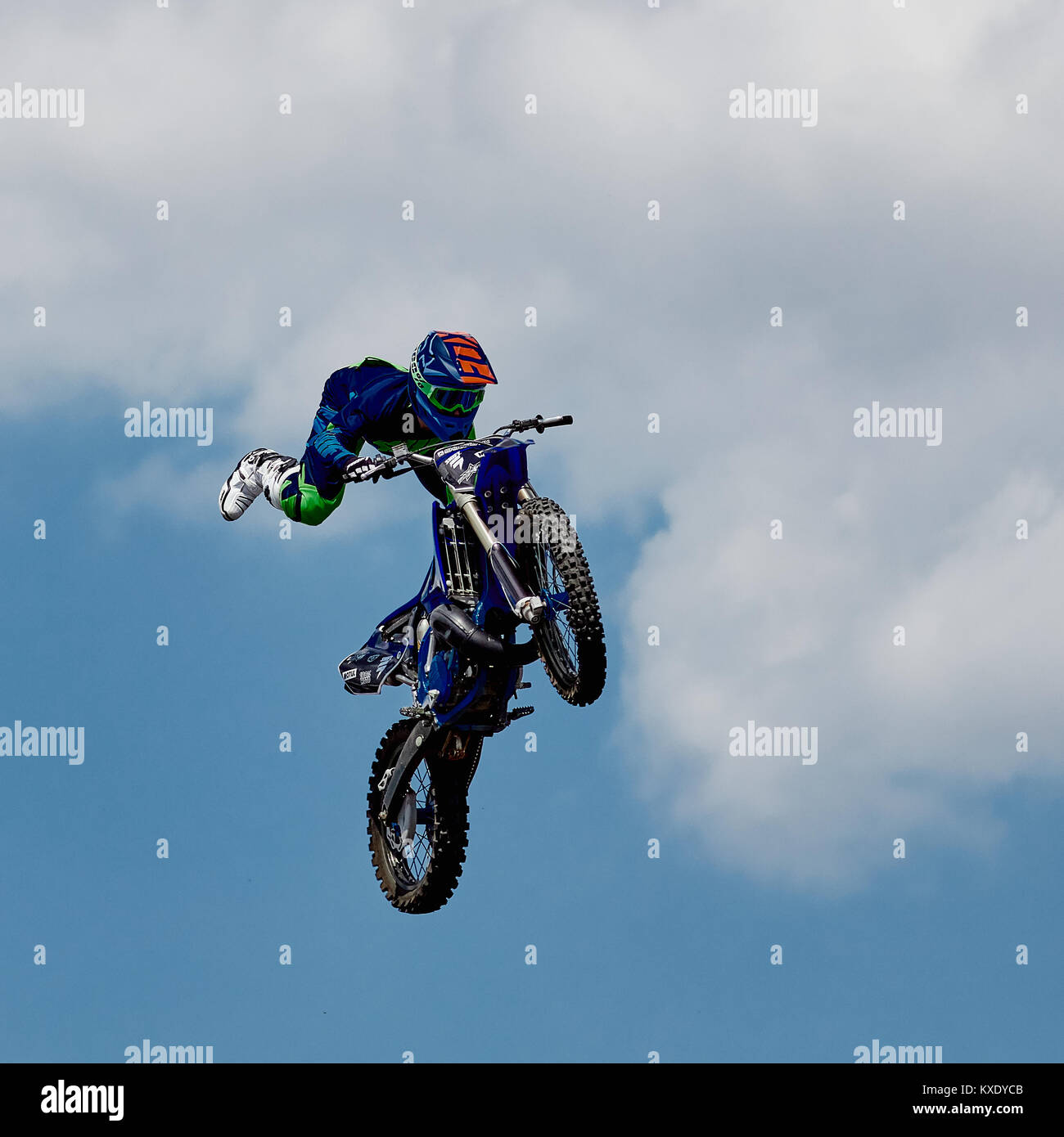 Professional rider at the FMX (Freestyle Motocross) make an acrobatic ...