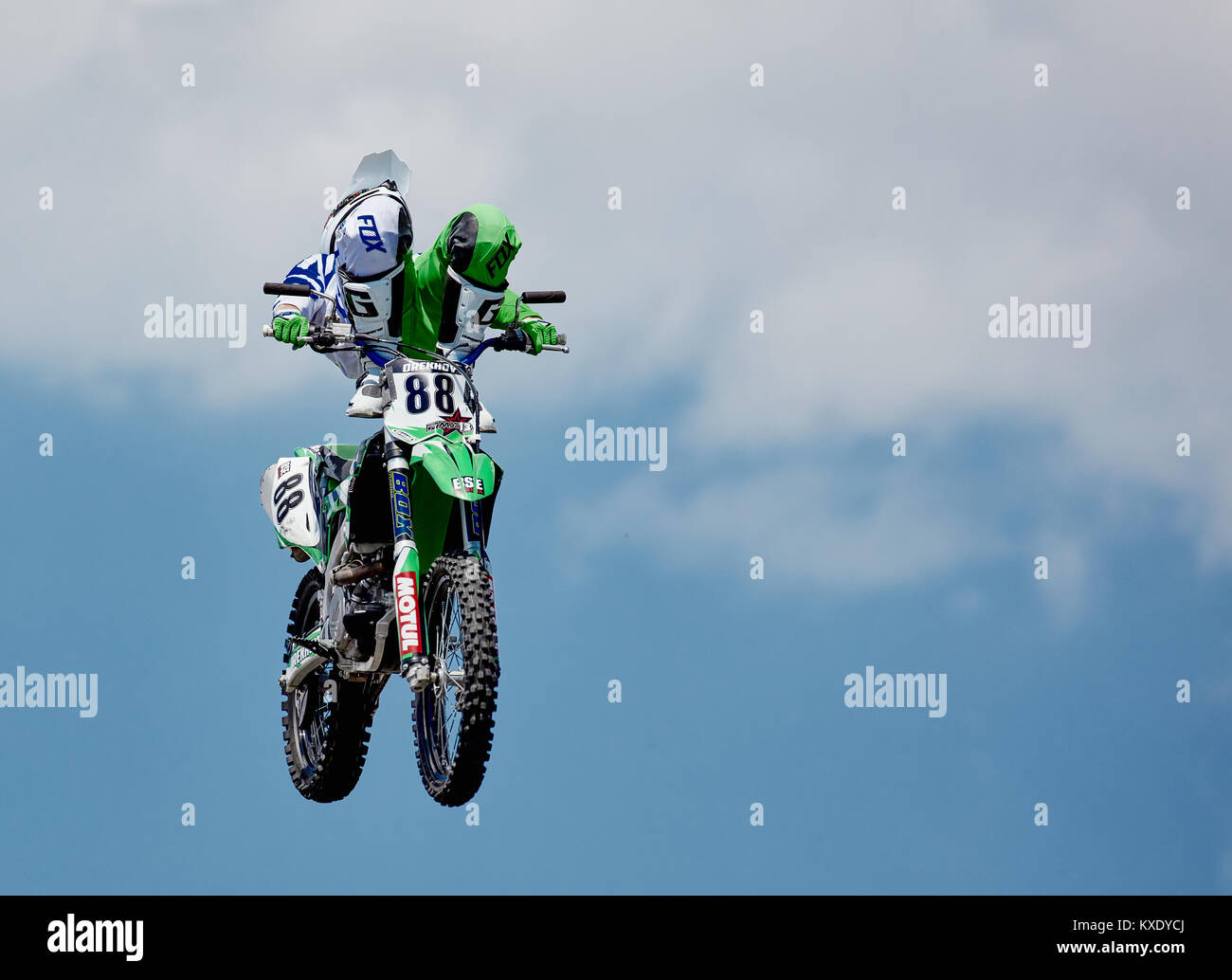 Professional rider at the FMX (Freestyle Motocross) make an acrobatic ...