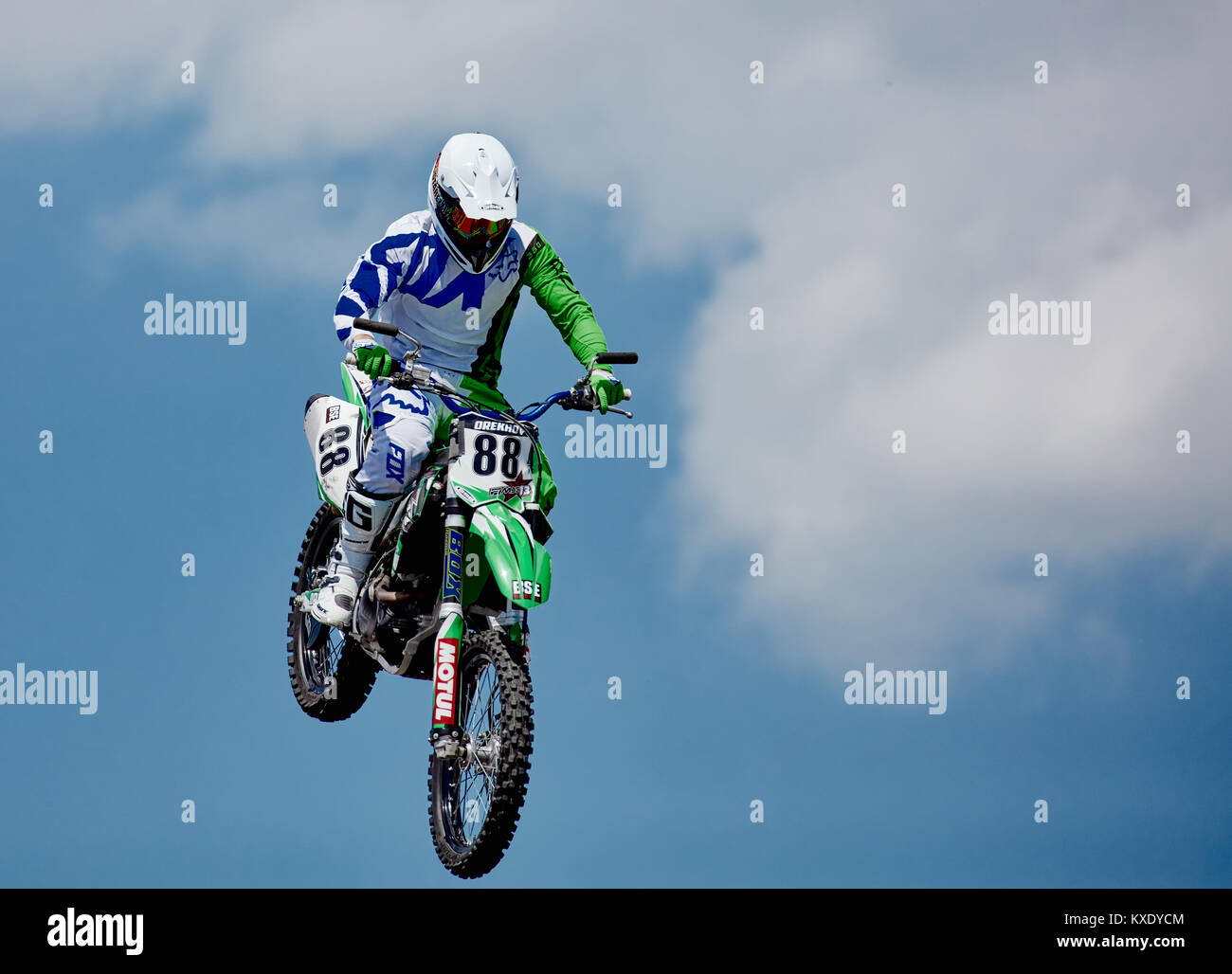 Professional rider at the FMX (Freestyle Motocross) make an acrobatic ...