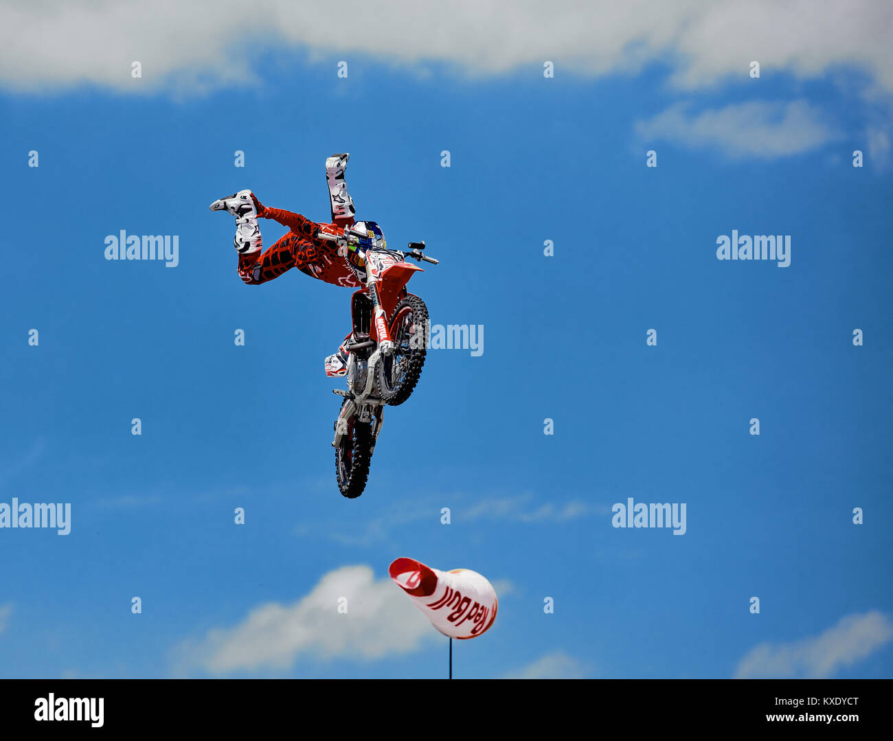 Professional rider at the FMX (Freestyle Motocross) make an acrobatic ...