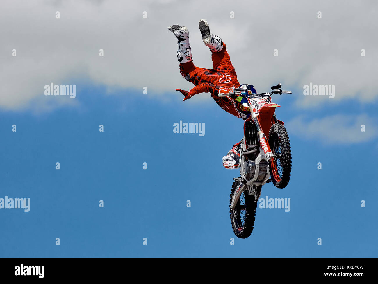 Professional rider at the FMX (Freestyle Motocross) make an acrobatic ...