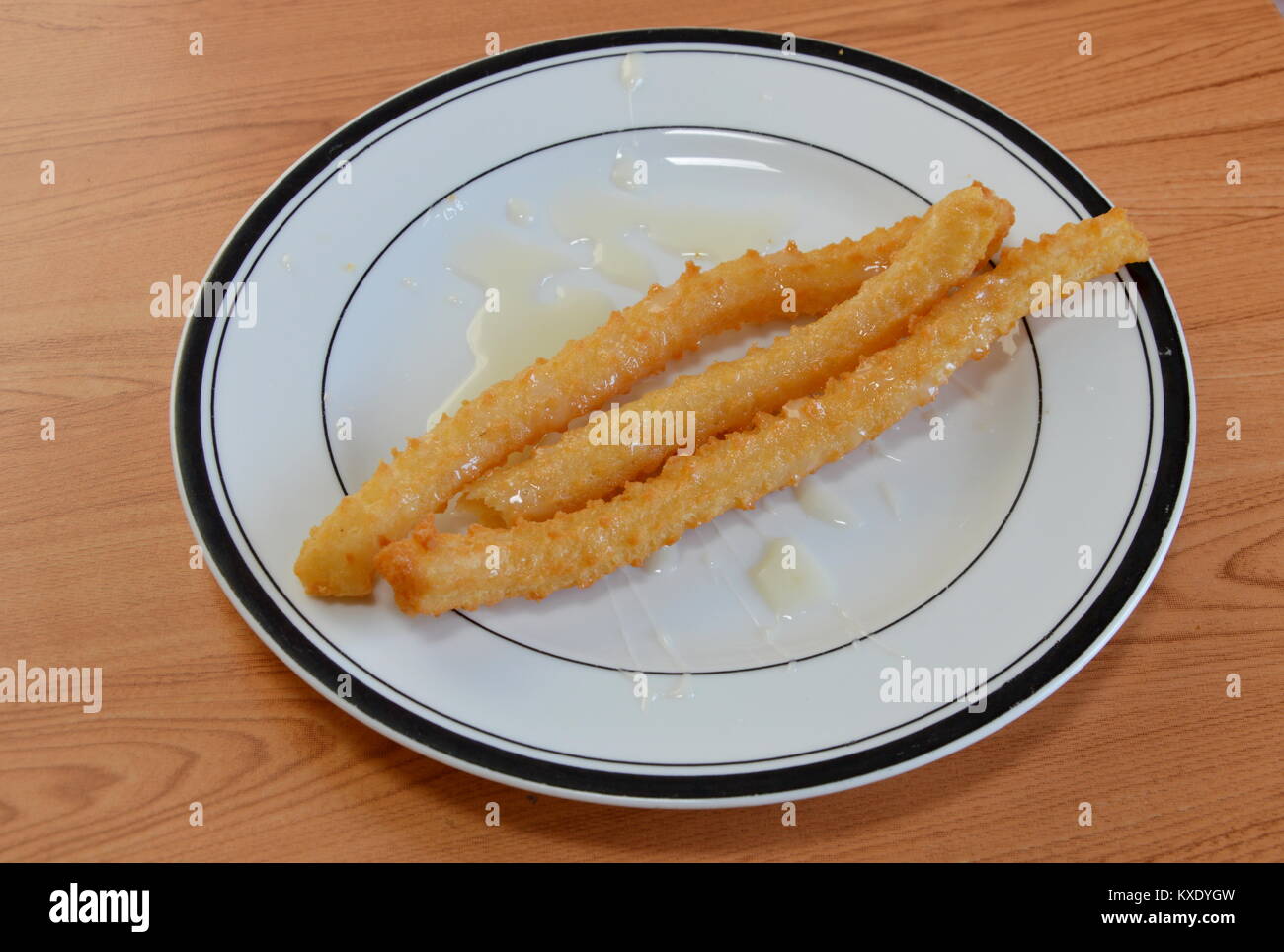 Churros Spanish deep fried dough stick Stock Photo - Alamy