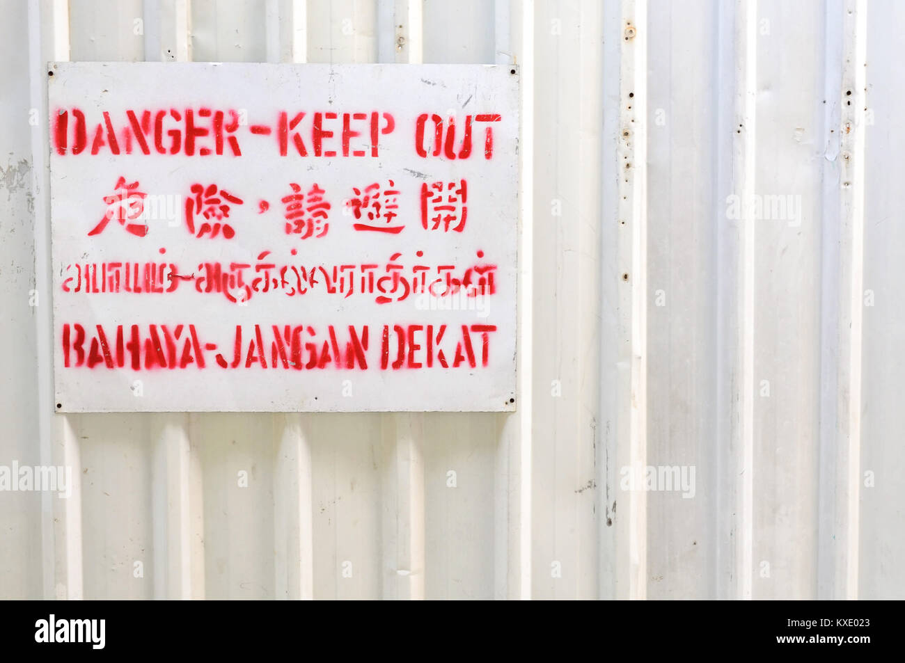 Danger signboard on white fence. For safety and danger, signs and ...