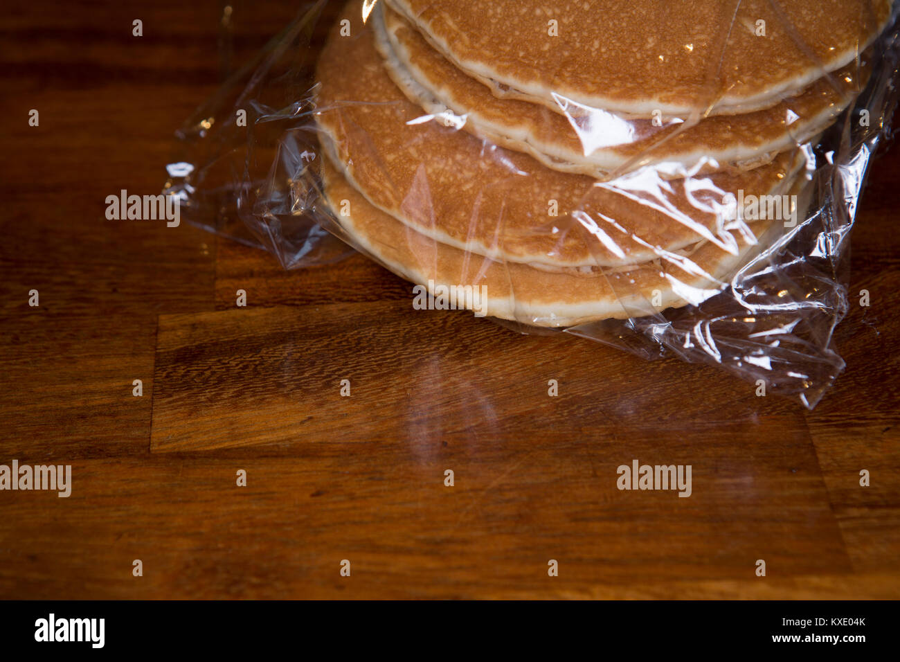 A packet of shop bought pancakes wrapped in cellophane and sitting on a ...