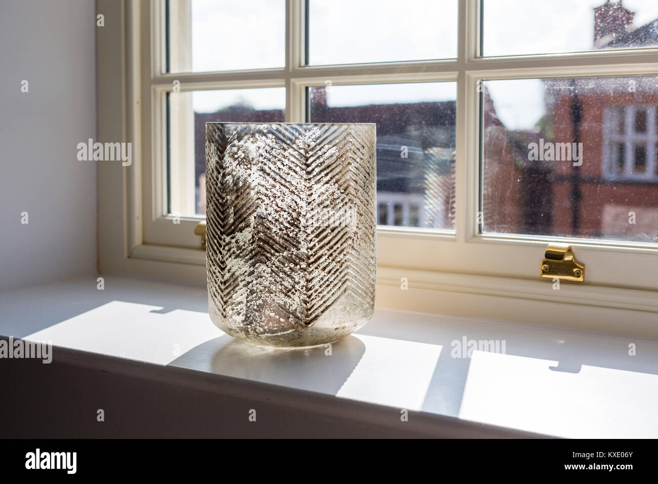 Vase on window sill Stock Photo - Alamy