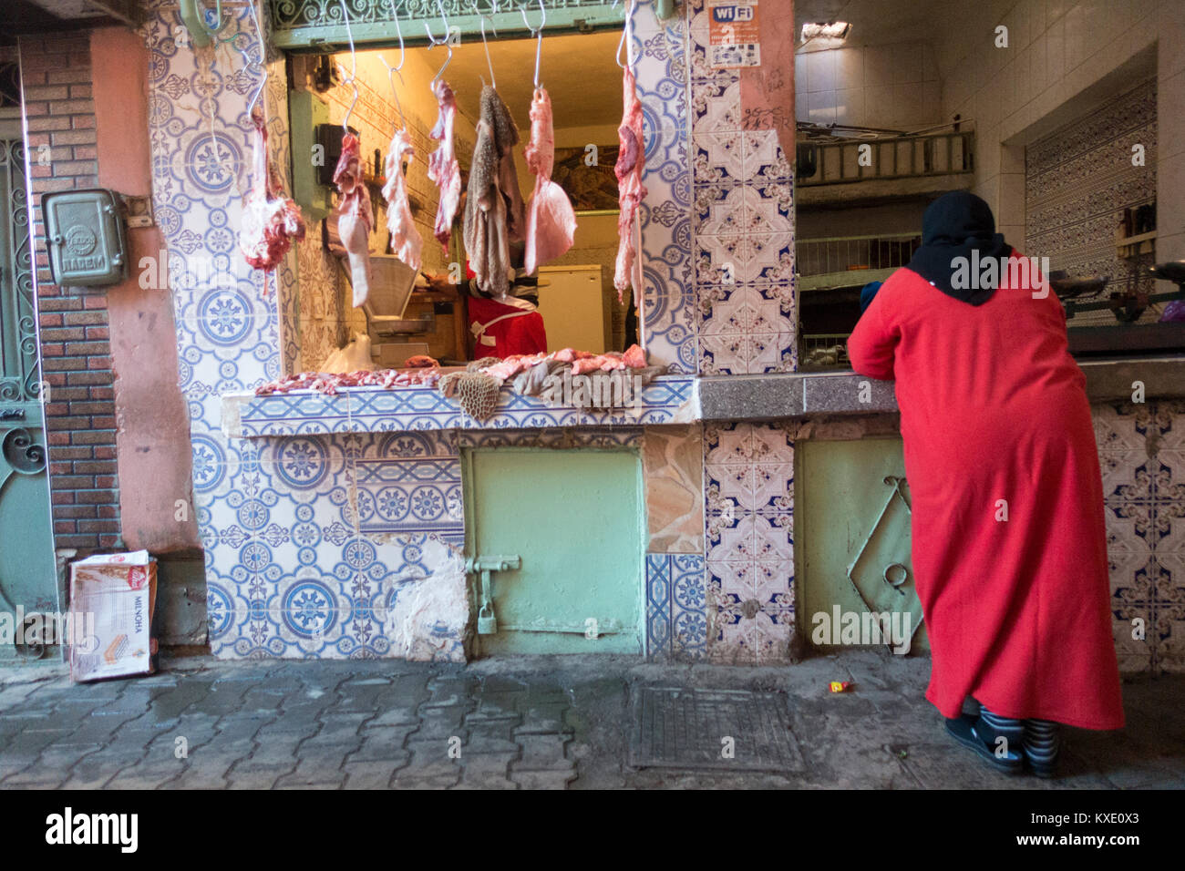 A woman buys meat in Marrakesh Stock Photo - Alamy