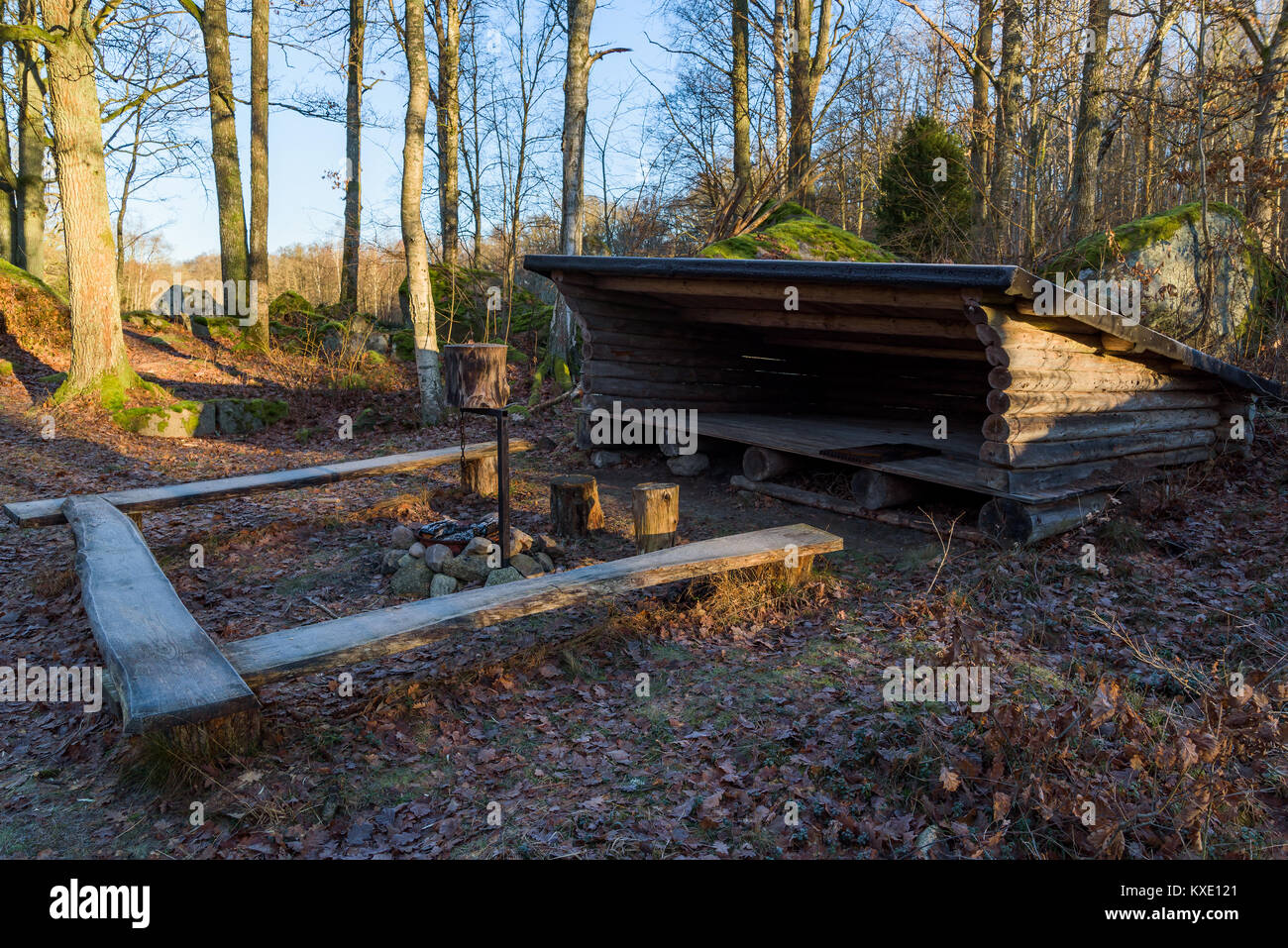 Camp site in forest area with fireplace and sheltered sleepover ...