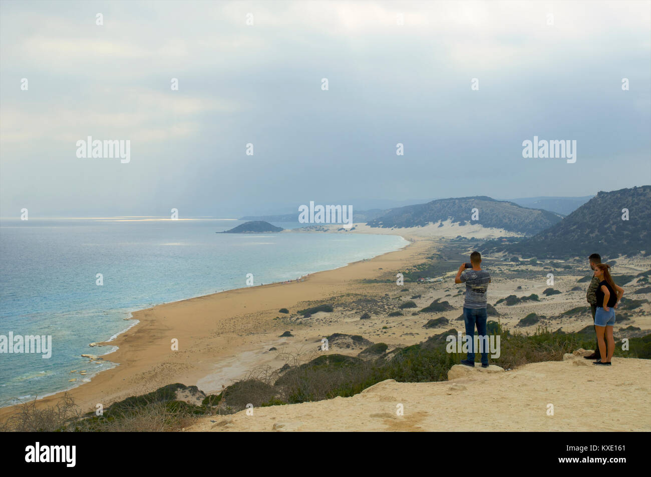 Tourists enjoying the view and spectacular sunlight over Big Sand Beach ...