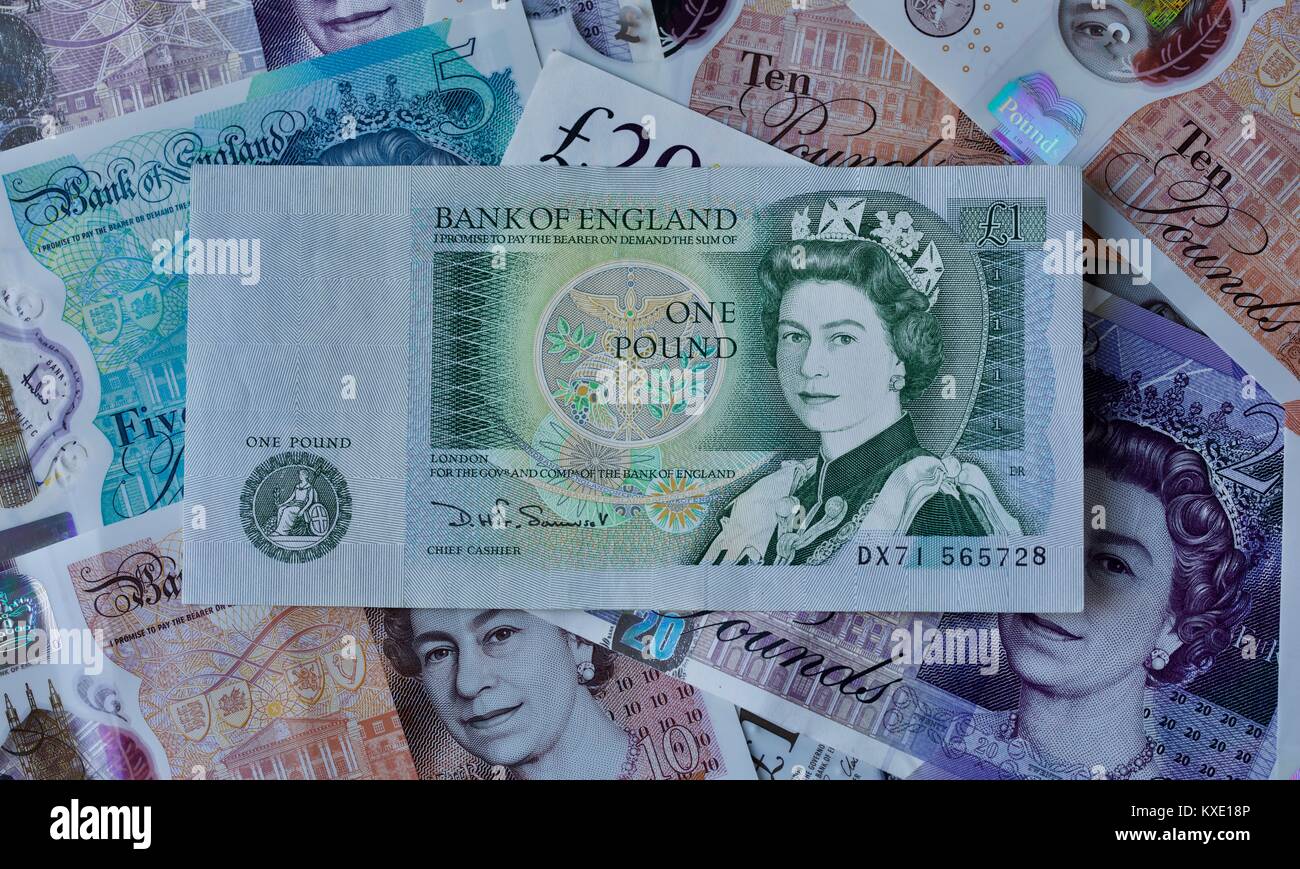 British £1 pound banknote with the new polymer banknotes in the ...