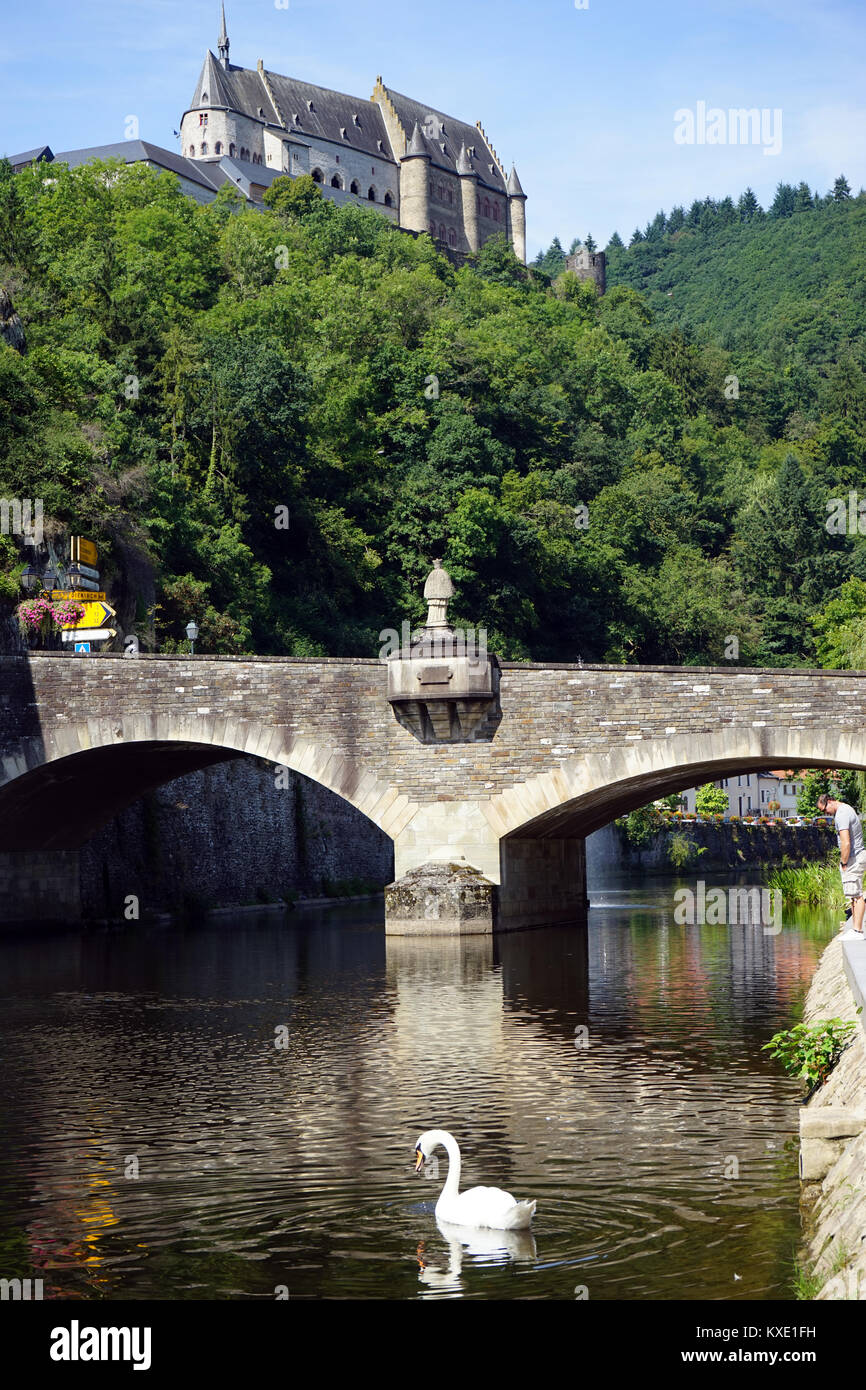 Castle on the hill and stone arch bridge on the river Our in Vianden ...