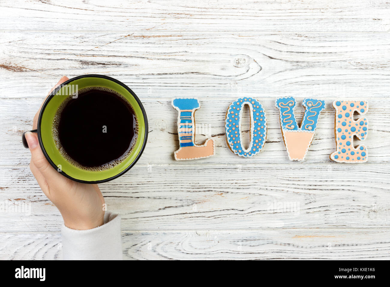 woman with hot cup of coffee, with biscuits. love concept. Love word ...