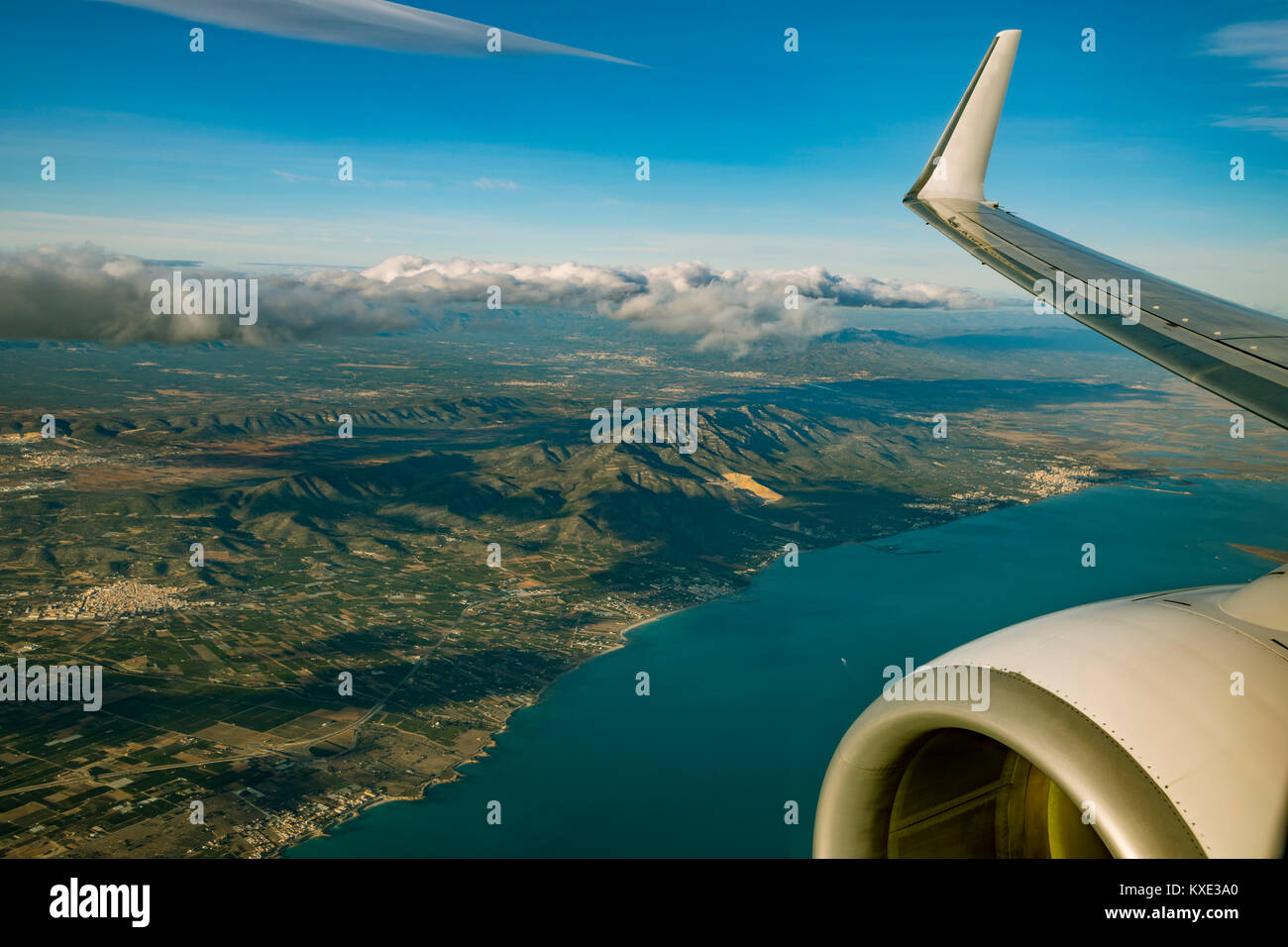 Scenic landscape view flight landing with clouds, hills, green fields ...
