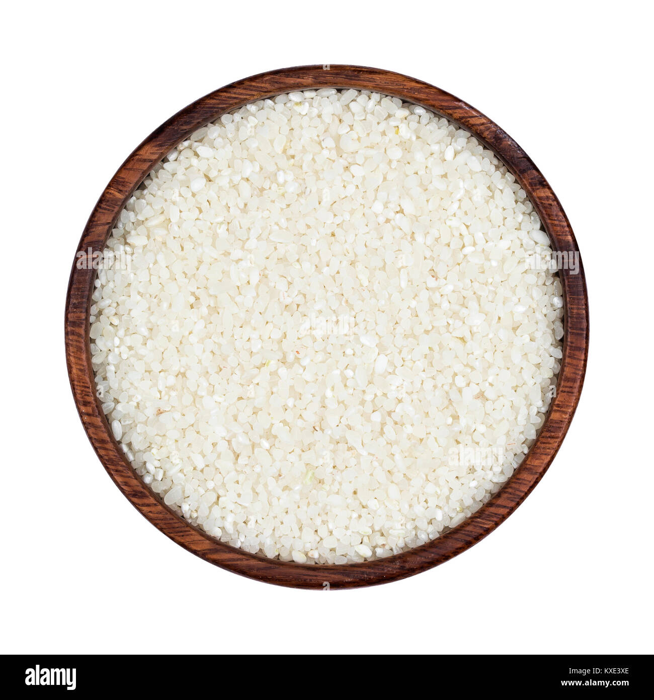 Small crushed rice in wooden bowl isolated on white background. Top ...