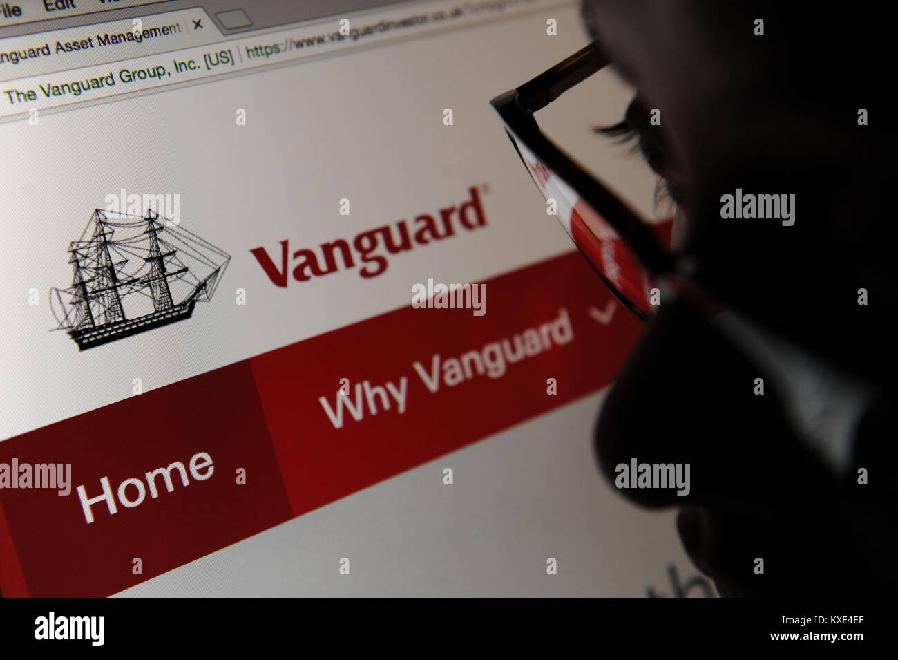 A woman looks at the Vanguard website Stock Photo - Alamy