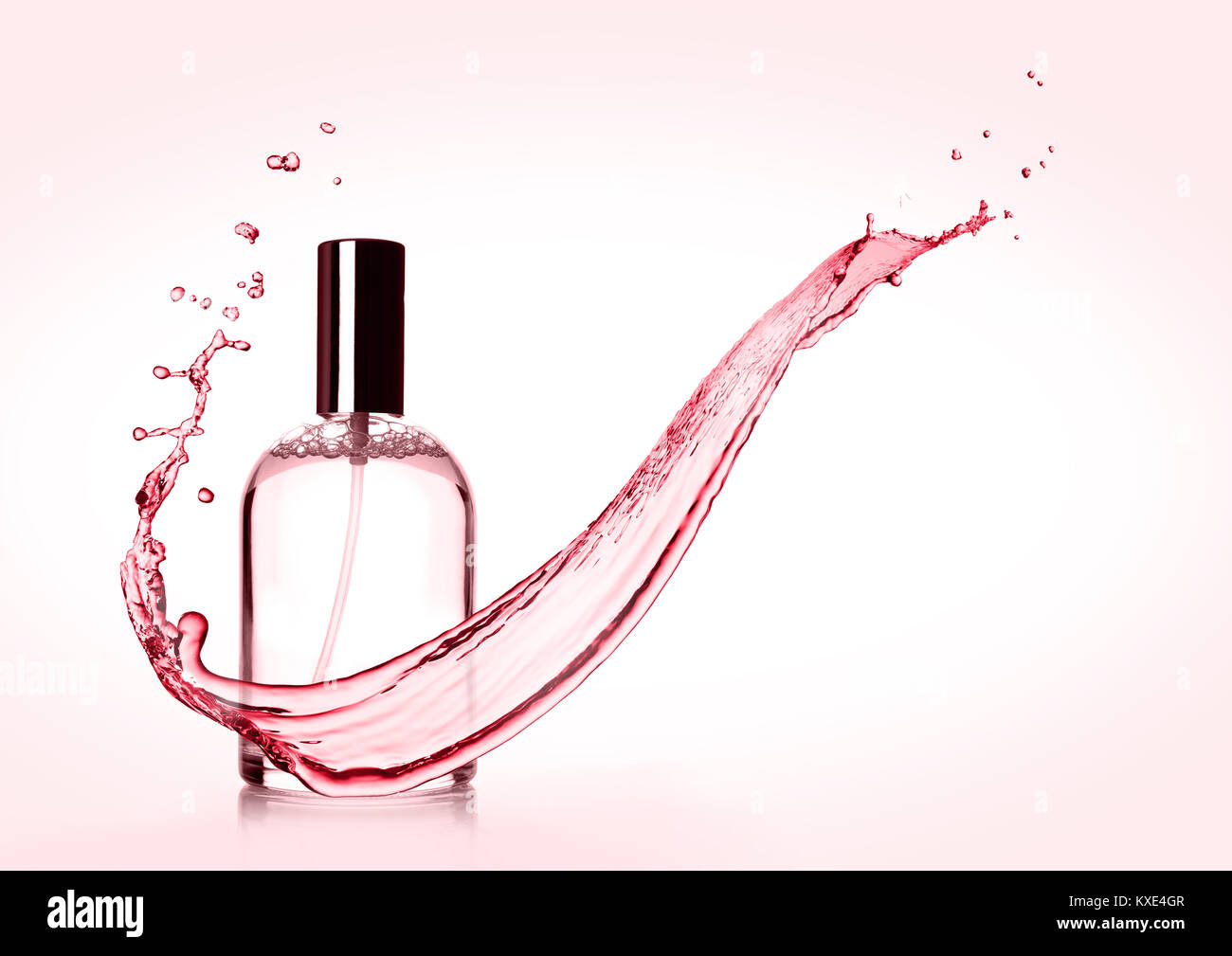 Luxury pink liquid perfume bottle with splashes Stock Photo - Alamy