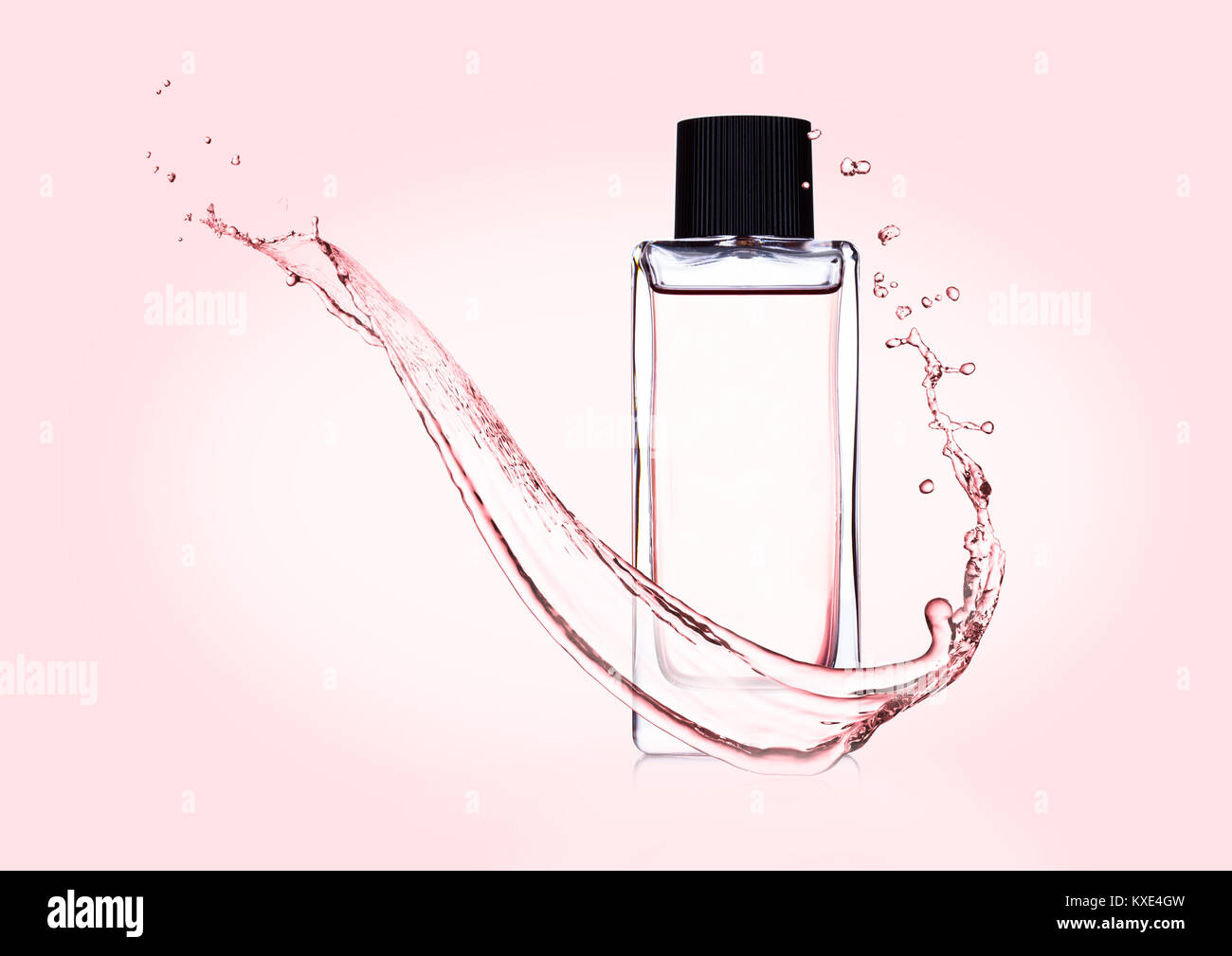 Luxury pink liquid perfume bottle with splashes Stock Photo - Alamy