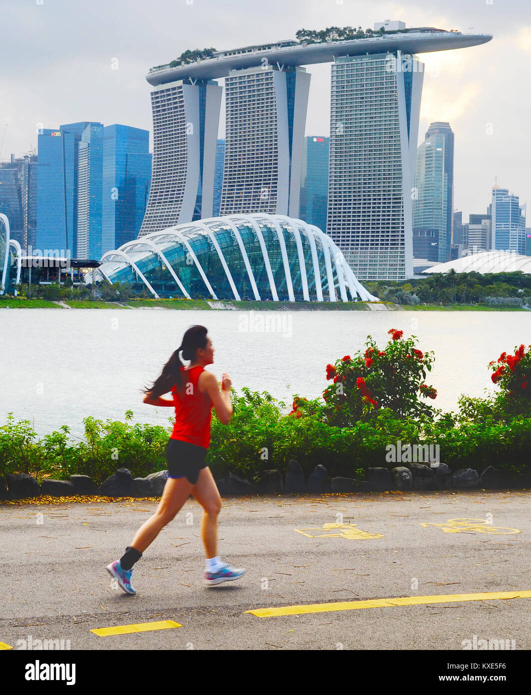 SINGAPORE - FEB 16, 2017: Beautiful young chinese woman running in ...