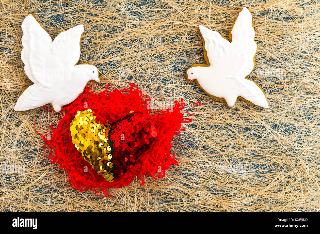 Two white pigeons. Two parts of the heart. Red heart Stock Photo - Alamy