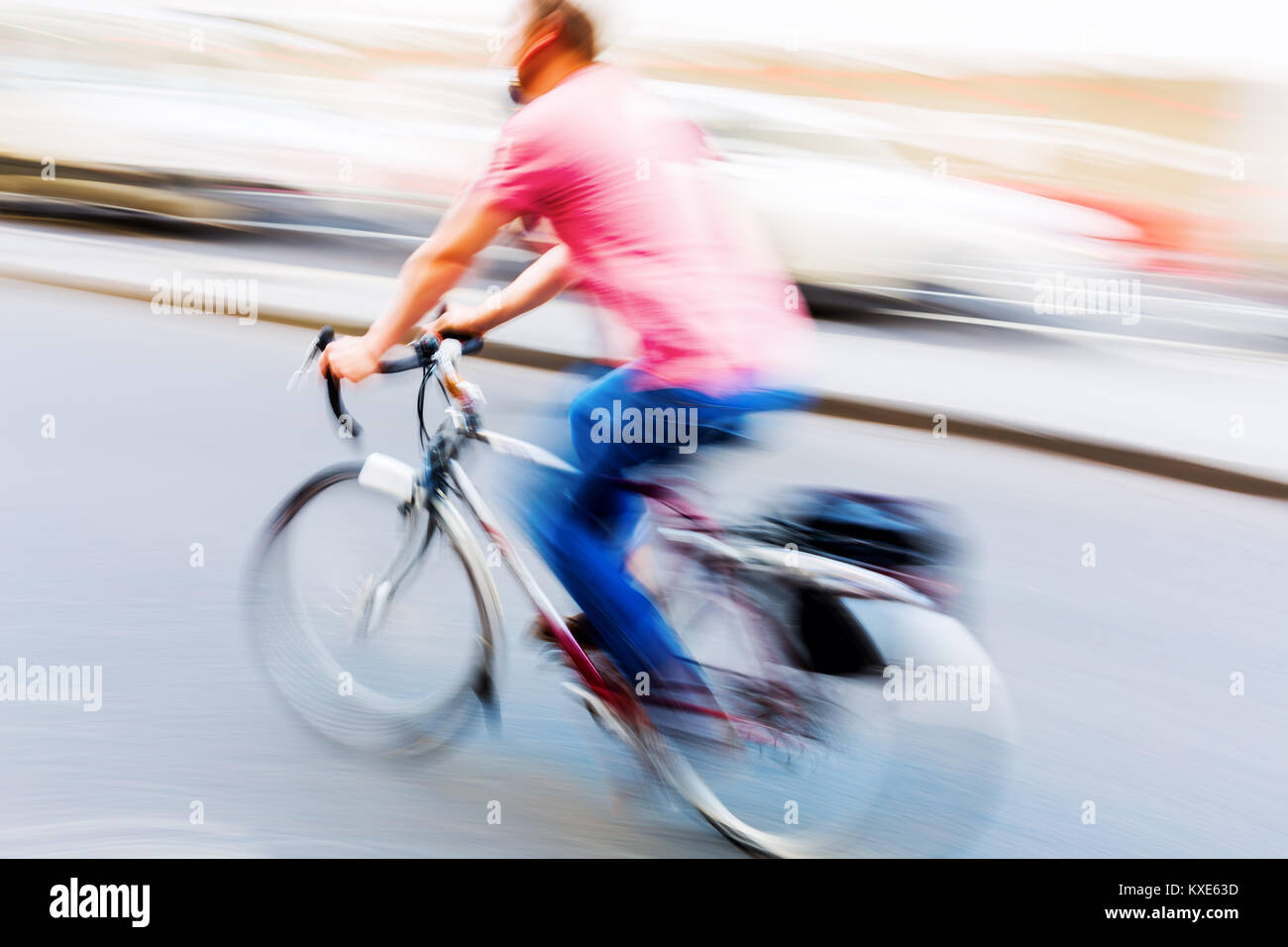 picture of an unrecognizable bicycle rider on the move on a street in ...