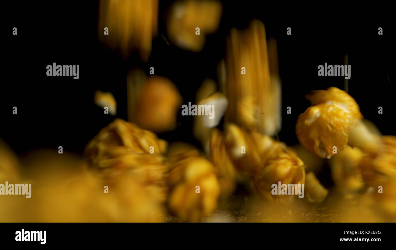 Falling pop corn on black background. Popcorn falls isolted on black ...